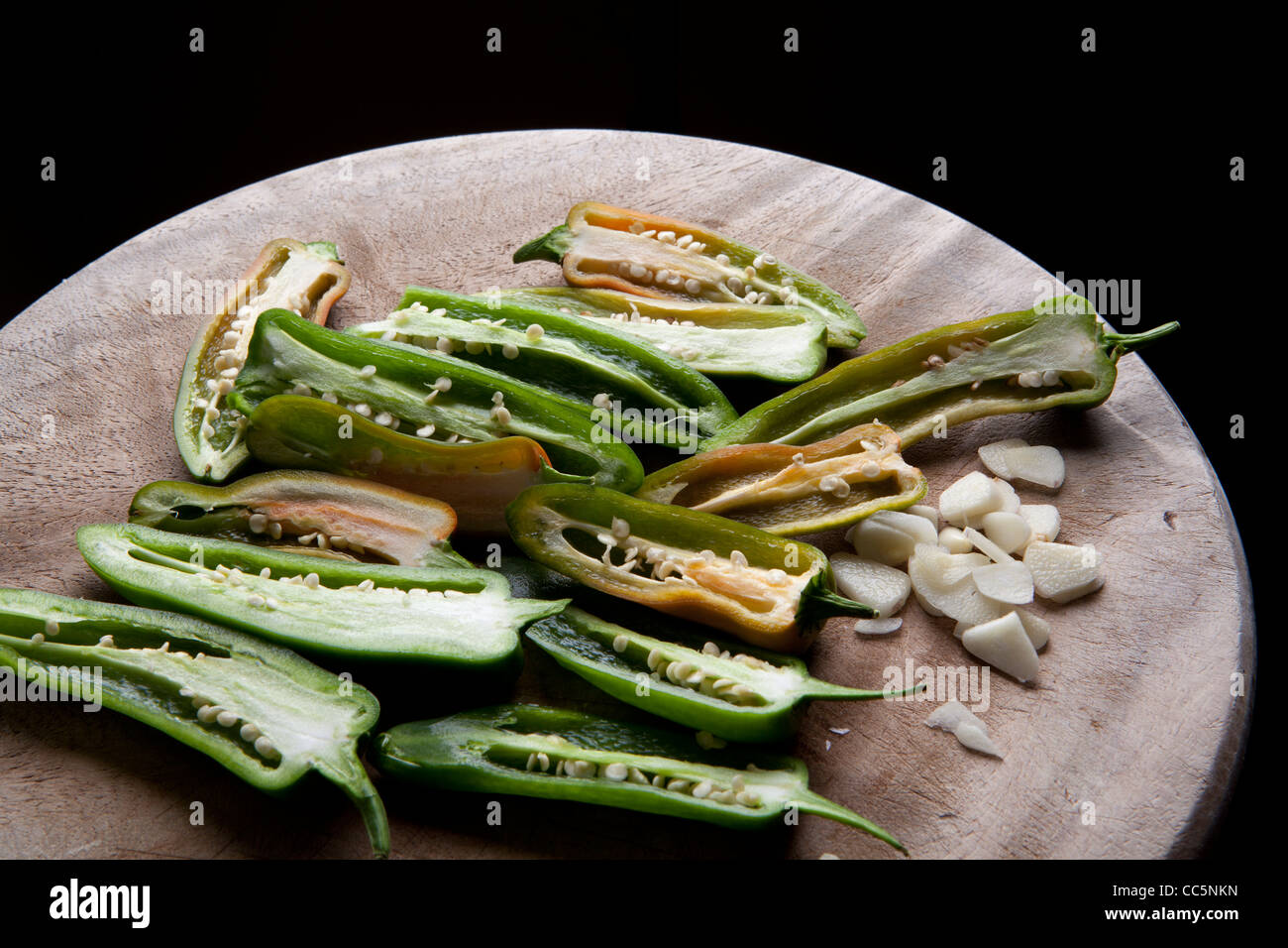 Green chillies and chopped garlic Stock Photo - Alamy