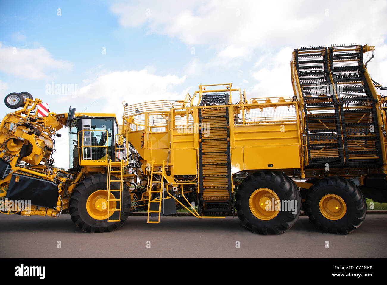 big yellow agricultural truck Stock Photo - Alamy