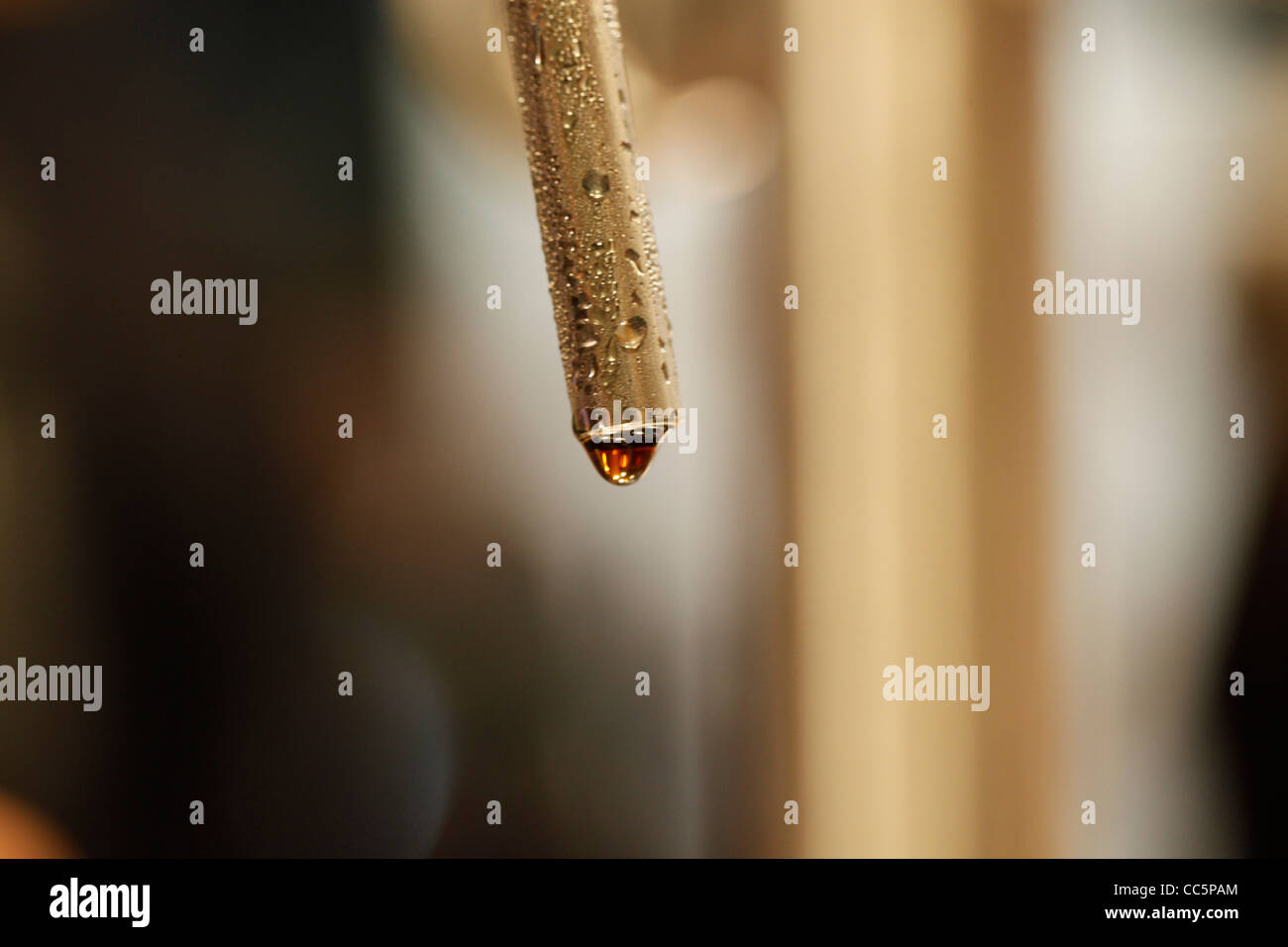 Drop of beer dripping from metallic beer tap Stock Photo - Alamy