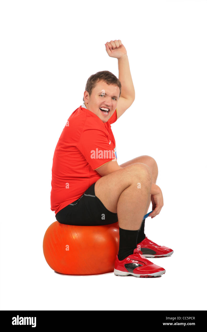 Man jumping on fitness sphere Stock Photo - Alamy