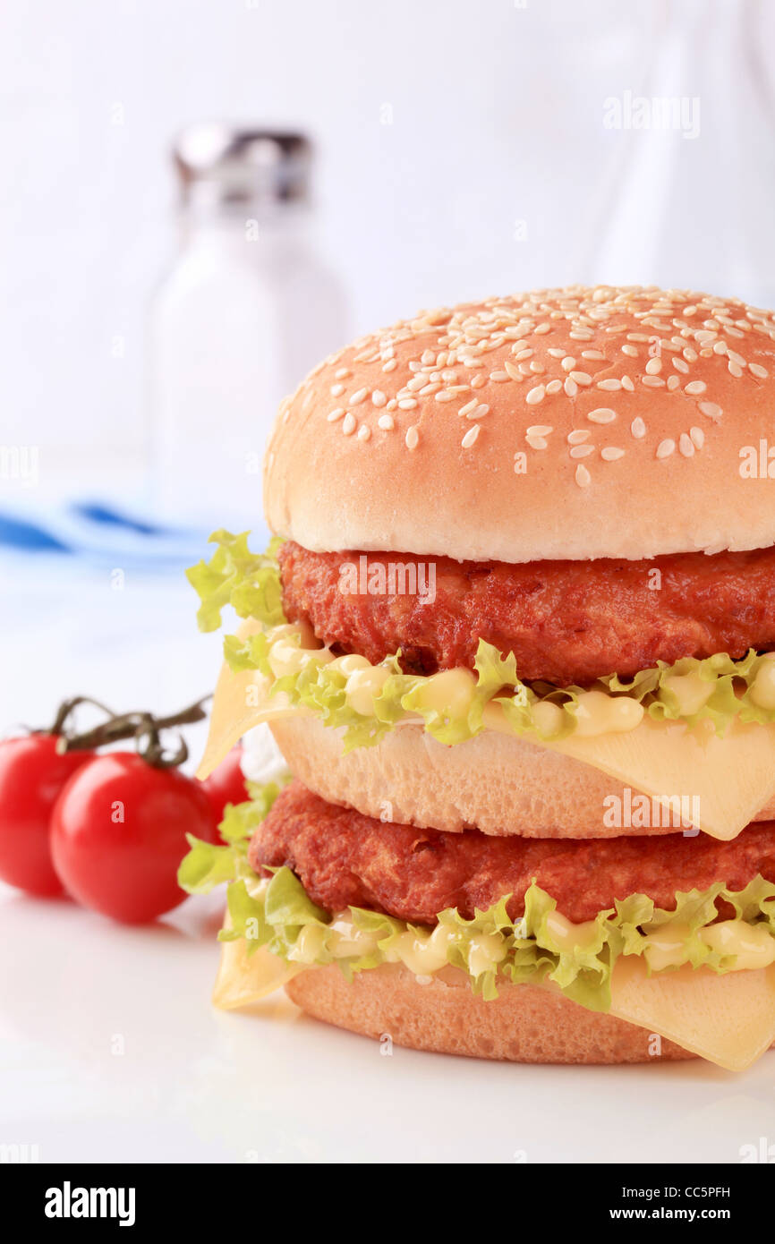 Closeup of a double cheeseburger Stock Photo - Alamy