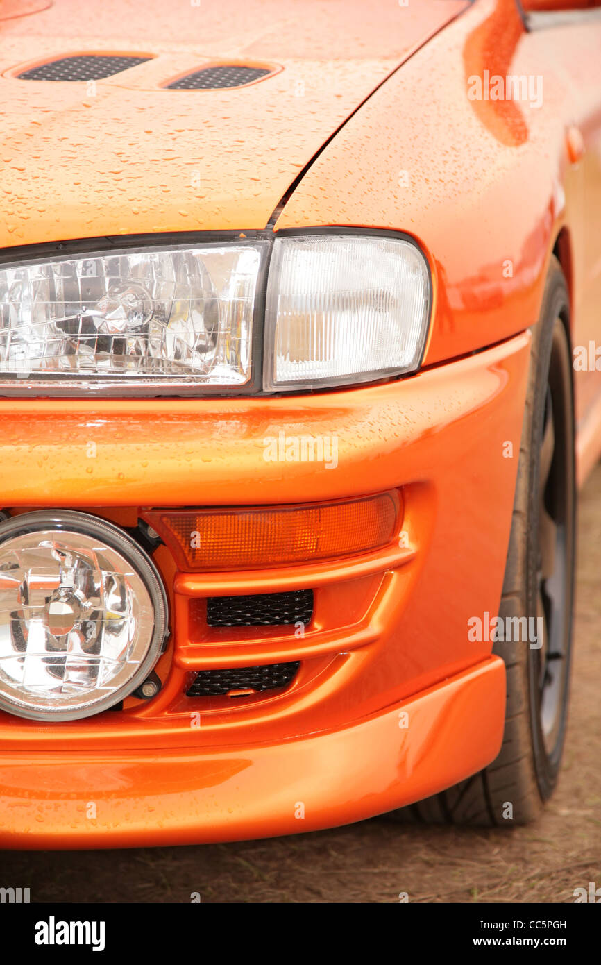 Orange sport car. Close up Stock Photo - Alamy