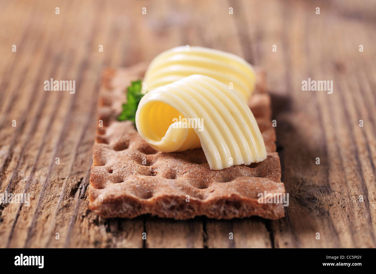 Crisp bread and curls of fresh butter Stock Photo - Alamy