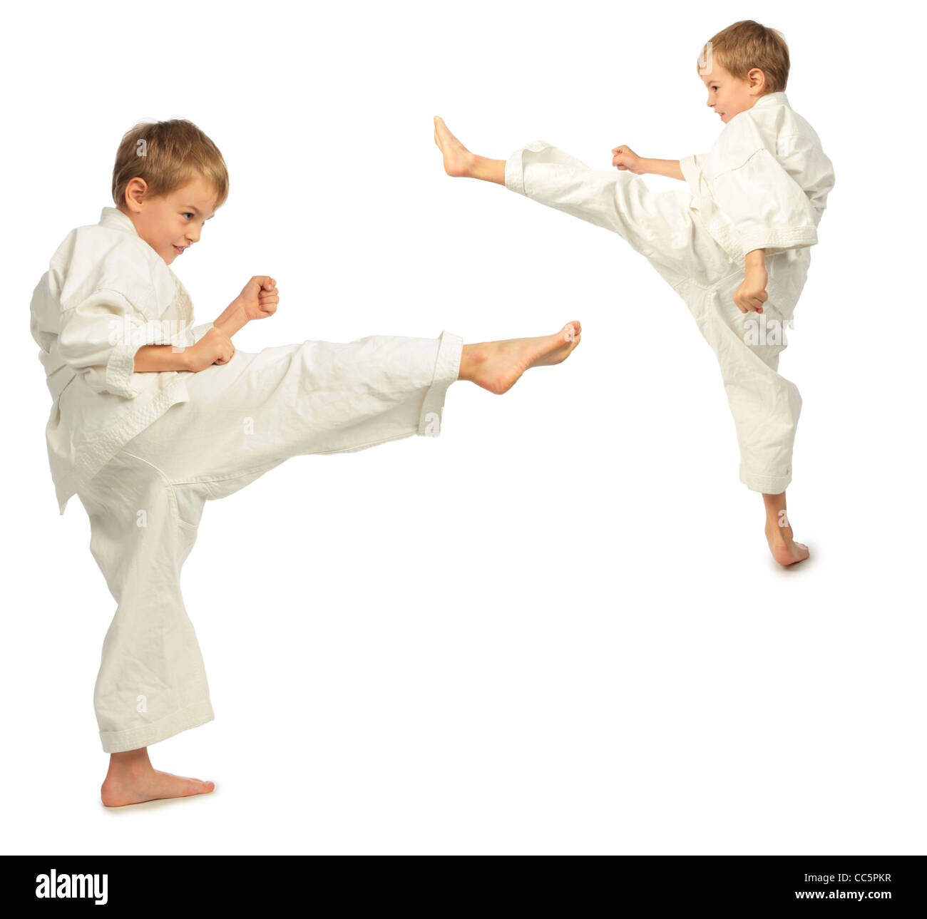 Karate boys kick by foot Stock Photo - Alamy
