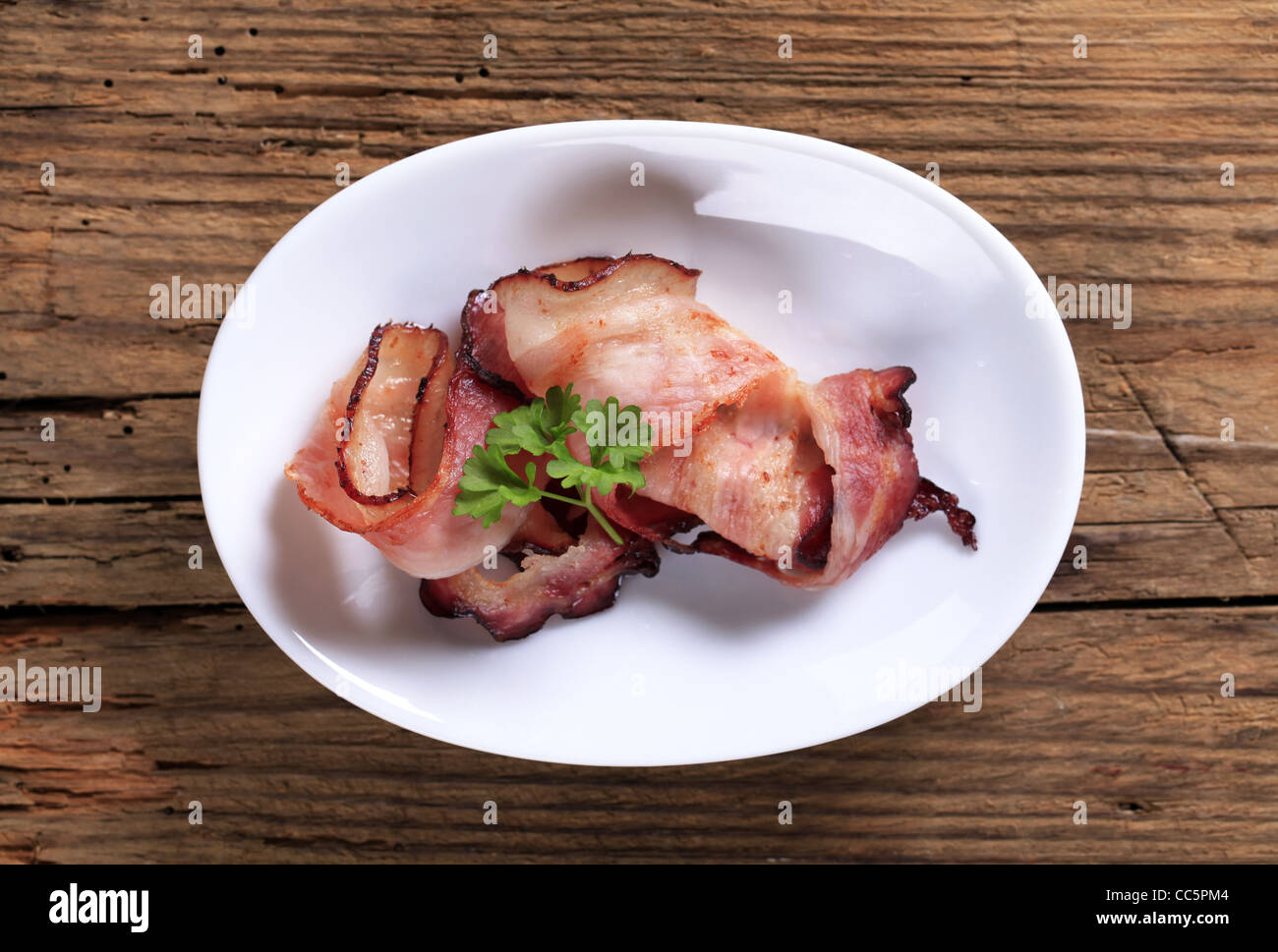 Slices of pan fried bacon Stock Photo - Alamy