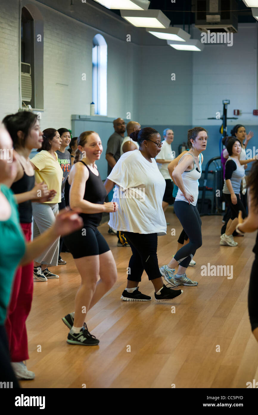 Exercisers participate in a group exercise class in Brooklyn in New ...
