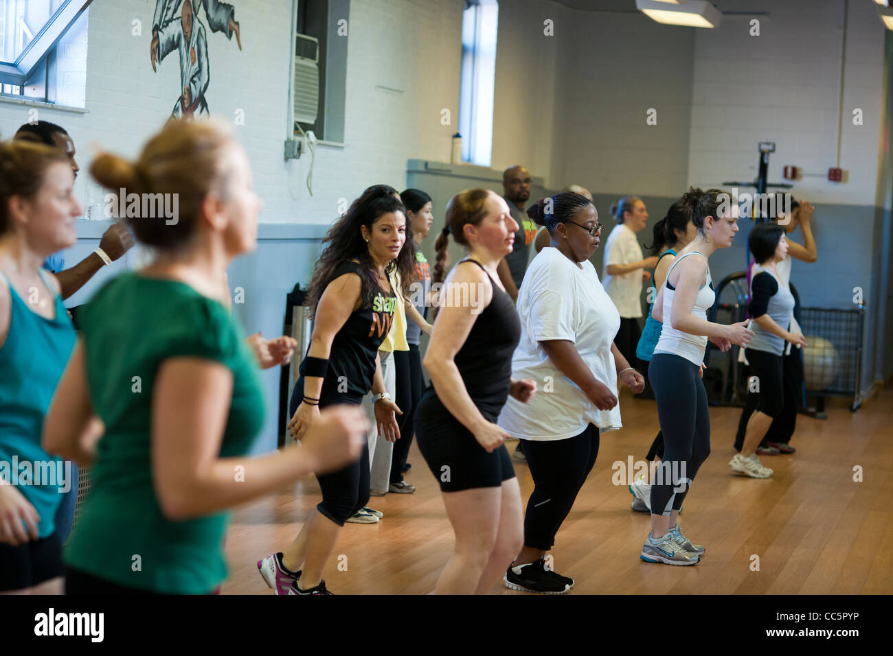 Exercisers participate in a group exercise class in Brooklyn in New ...