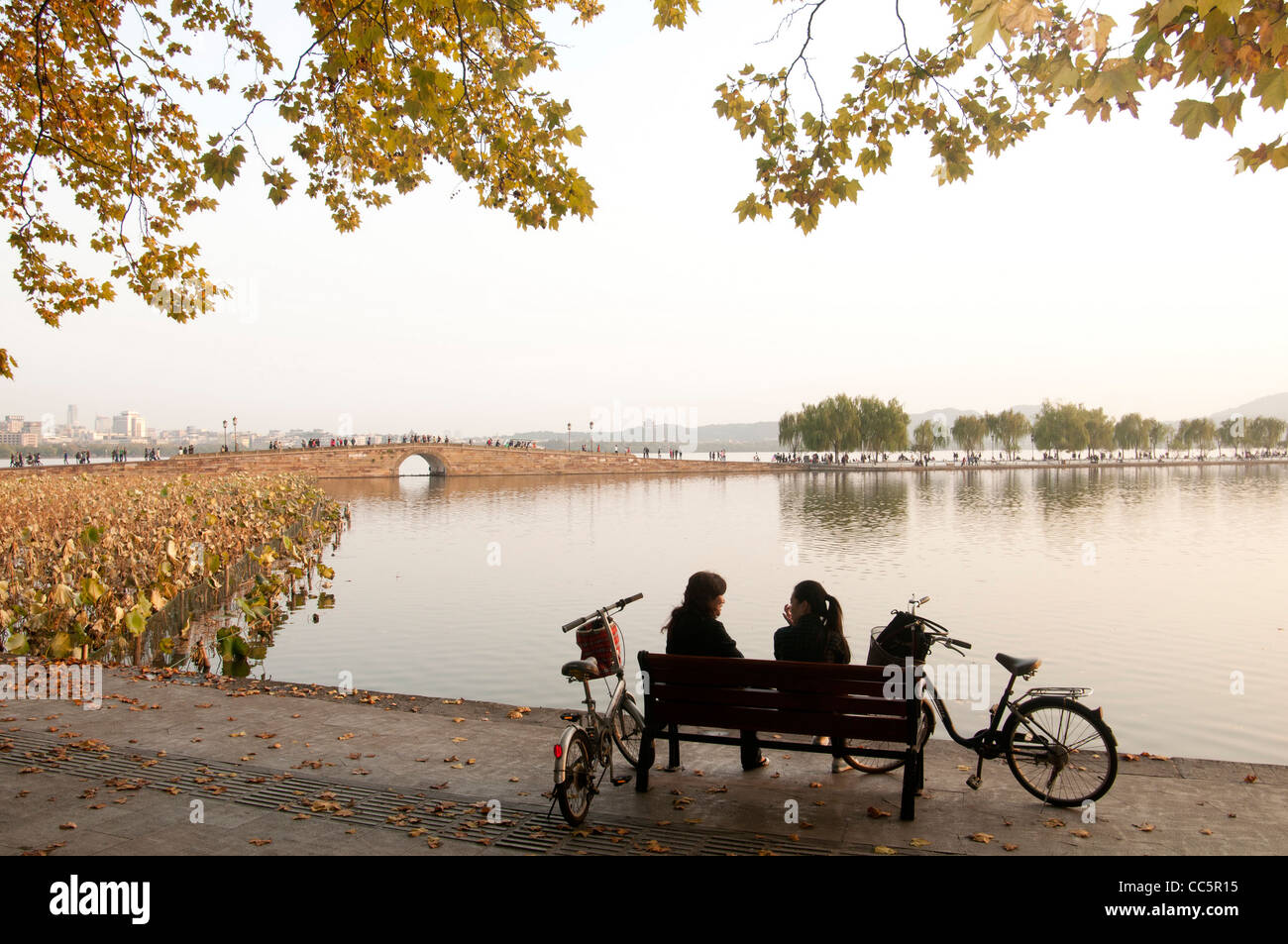 Chinese women resting beside West Lake, Hangzhou, Zhejiang , China ...