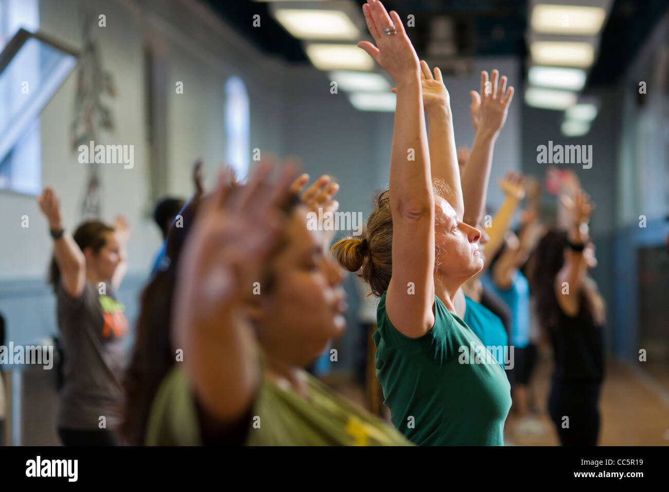 Exercisers participate in a group exercise class in Brooklyn in New ...