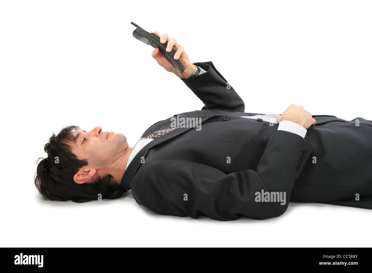 Lying on back businessman with phone Stock Photo - Alamy