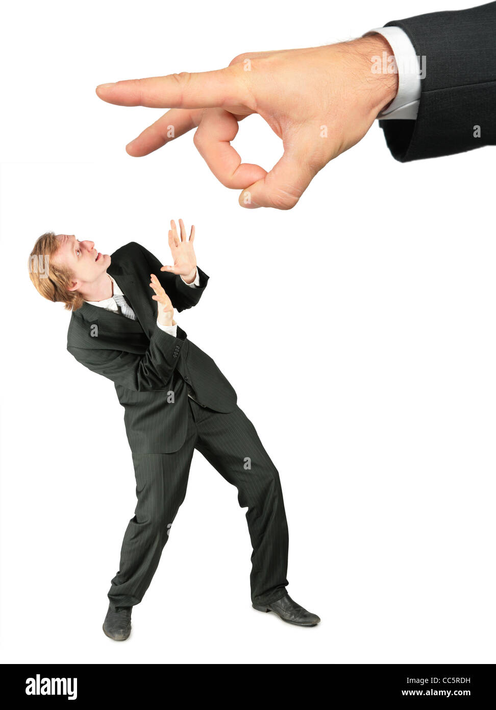 Scared businessman and Hand gives flick Stock Photo - Alamy