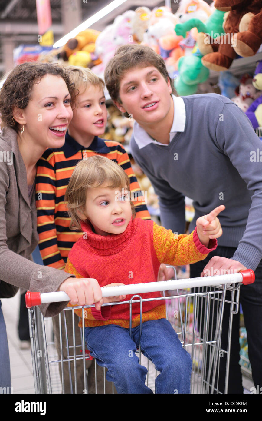 Parents with children in shop Stock Photo - Alamy