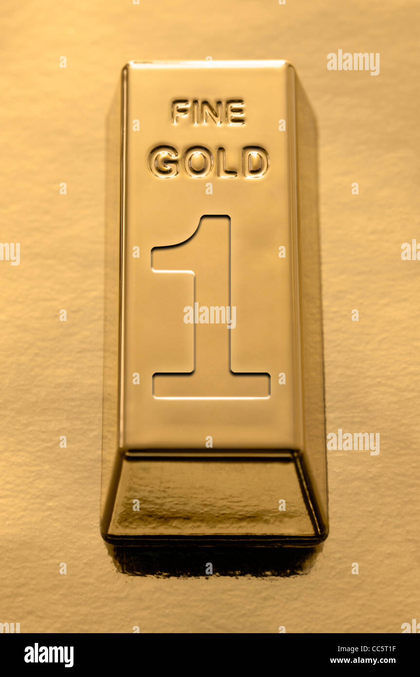 Gold Bar with a number one embossed on it on a gold background Stock ...
