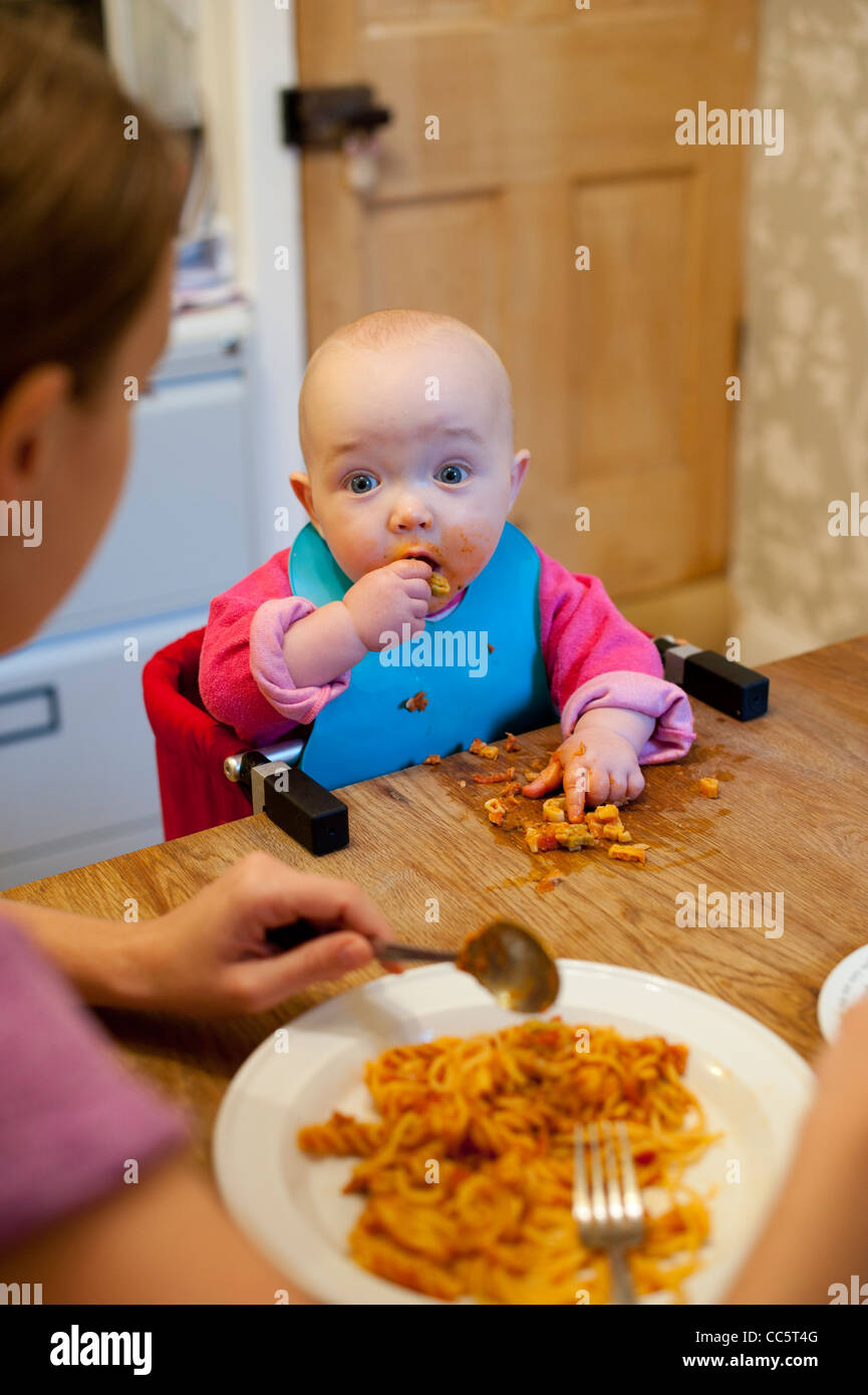 Baby Boy feeding himself Stock Photo - Alamy
