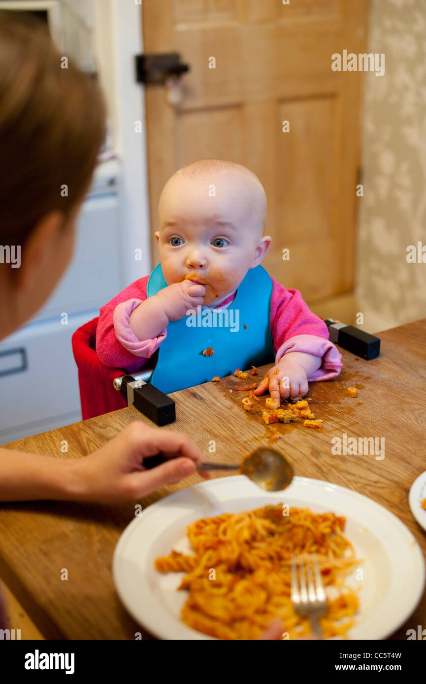 Baby Boy feeding himself Stock Photo - Alamy