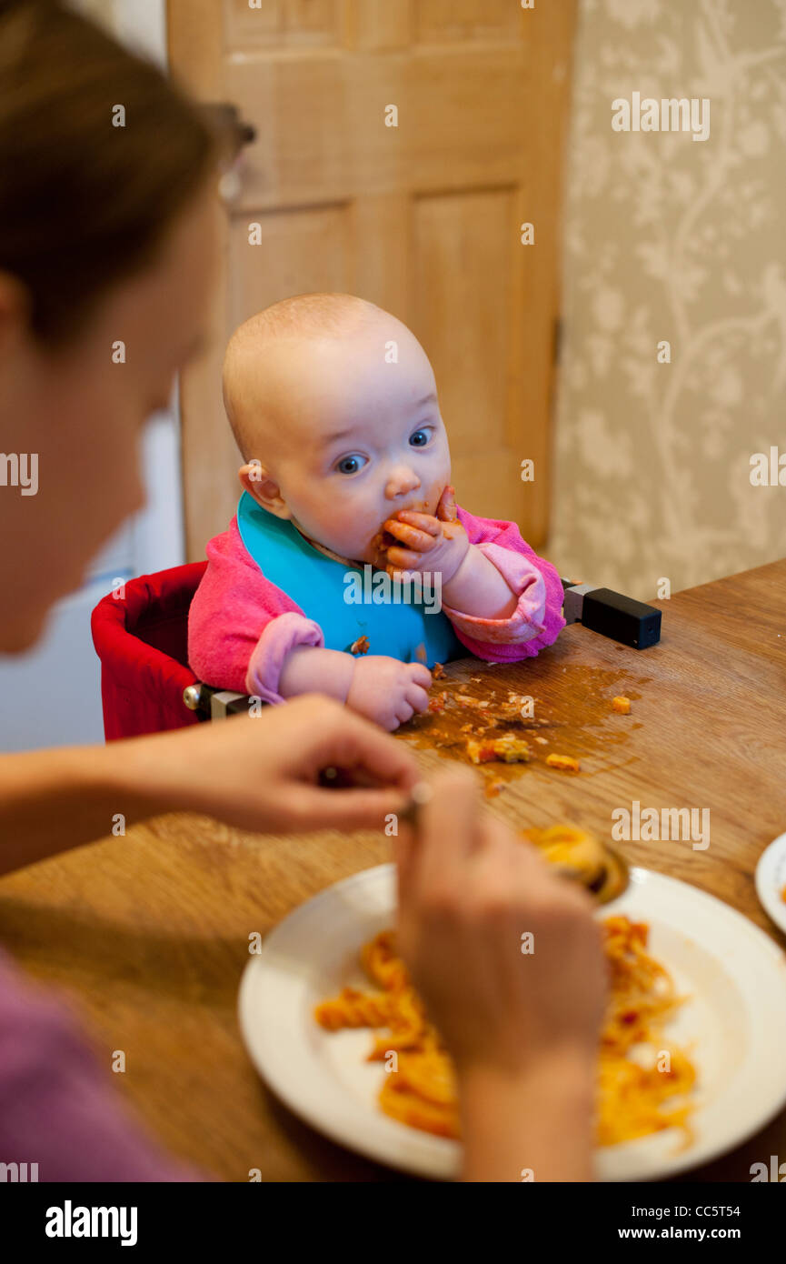 Baby Boy feeding himself Stock Photo - Alamy