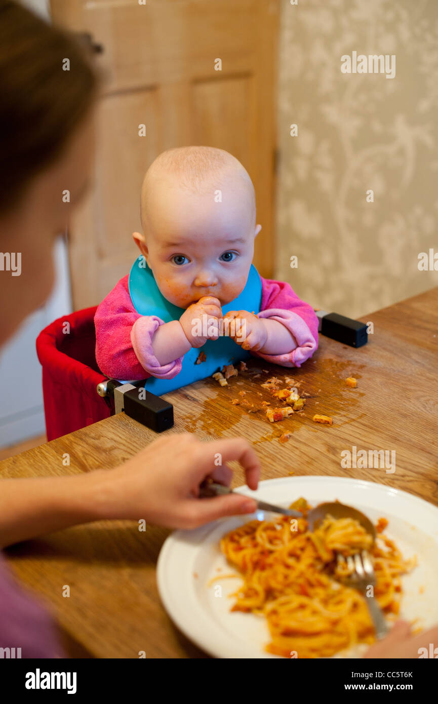 Baby Boy feeding himself Stock Photo - Alamy