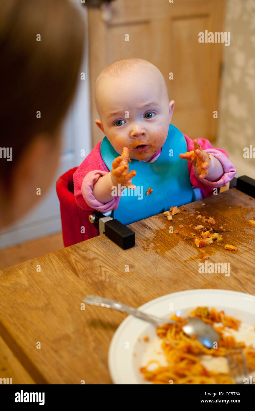 Baby Boy feeding himself Stock Photo - Alamy