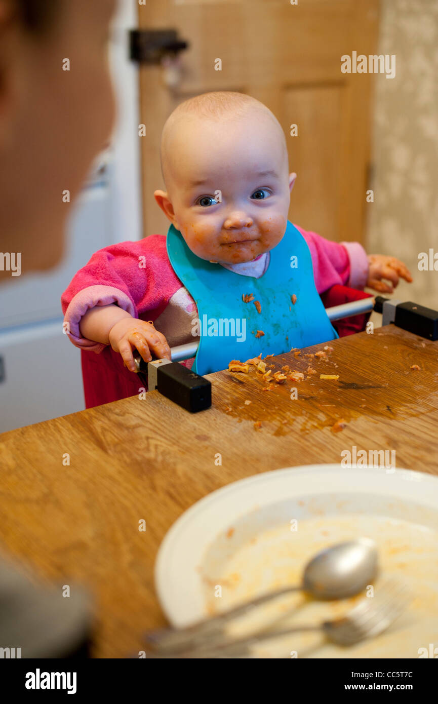 Baby Boy feeding himself Stock Photo - Alamy