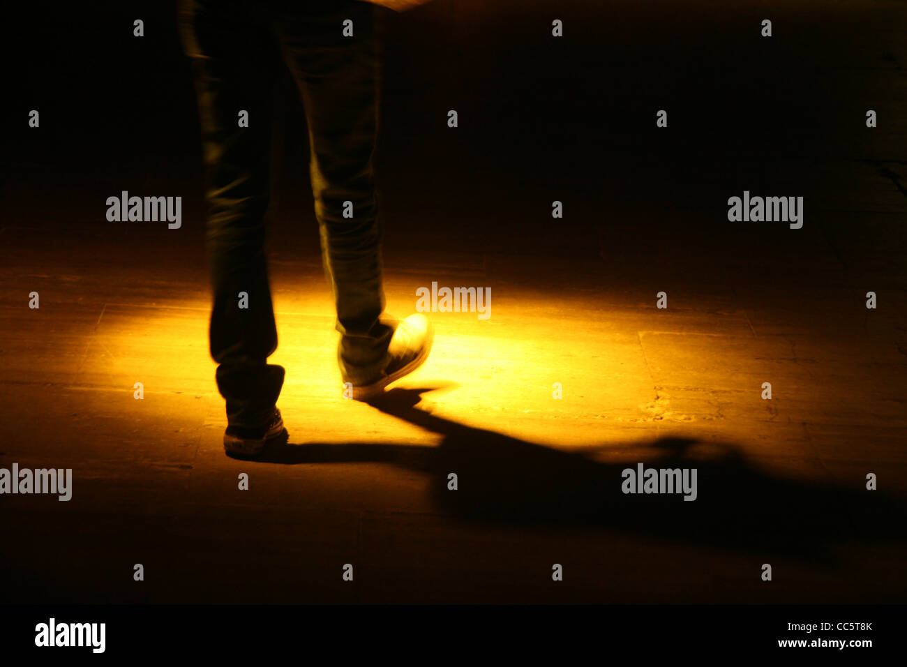 Man walking down back alley hi-res stock photography and images - Alamy