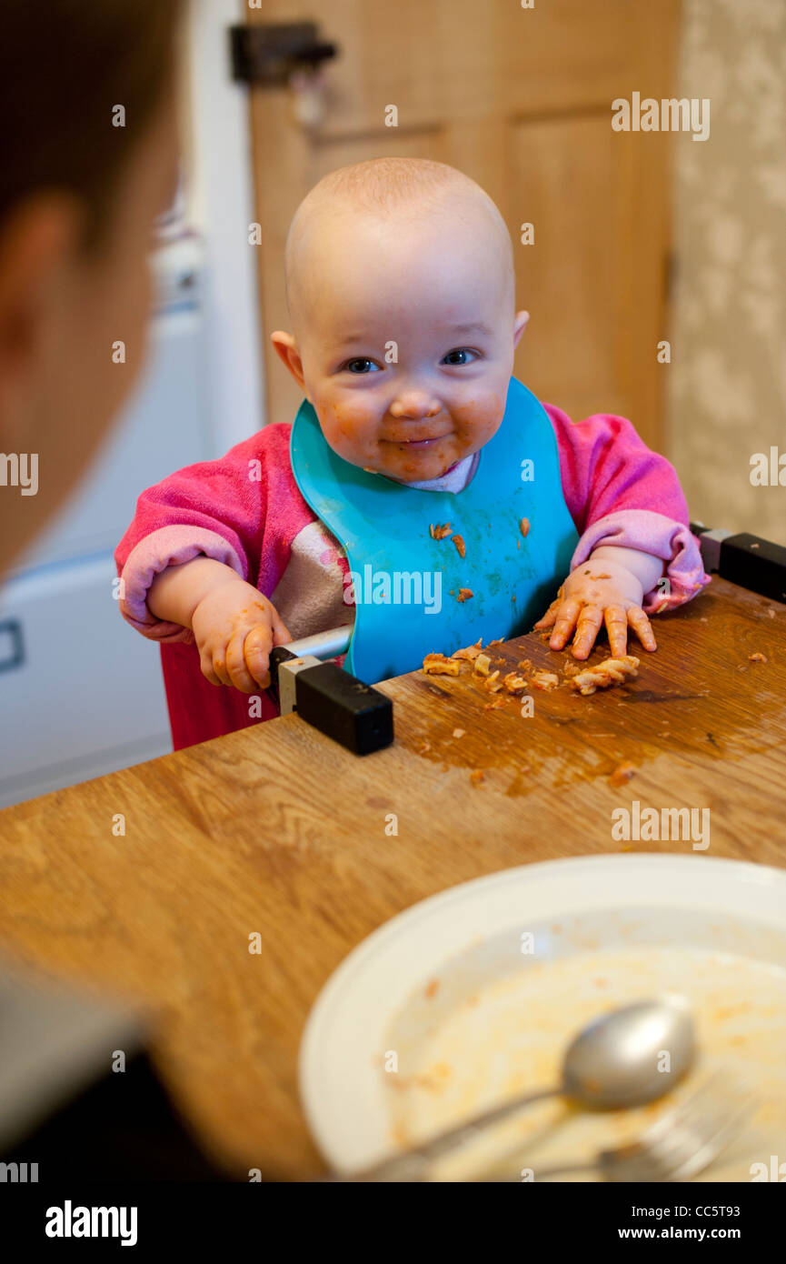 Baby Boy feeding himself Stock Photo - Alamy