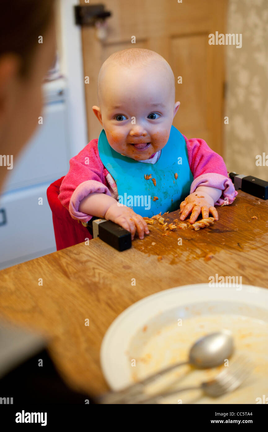 Baby Boy feeding himself Stock Photo - Alamy