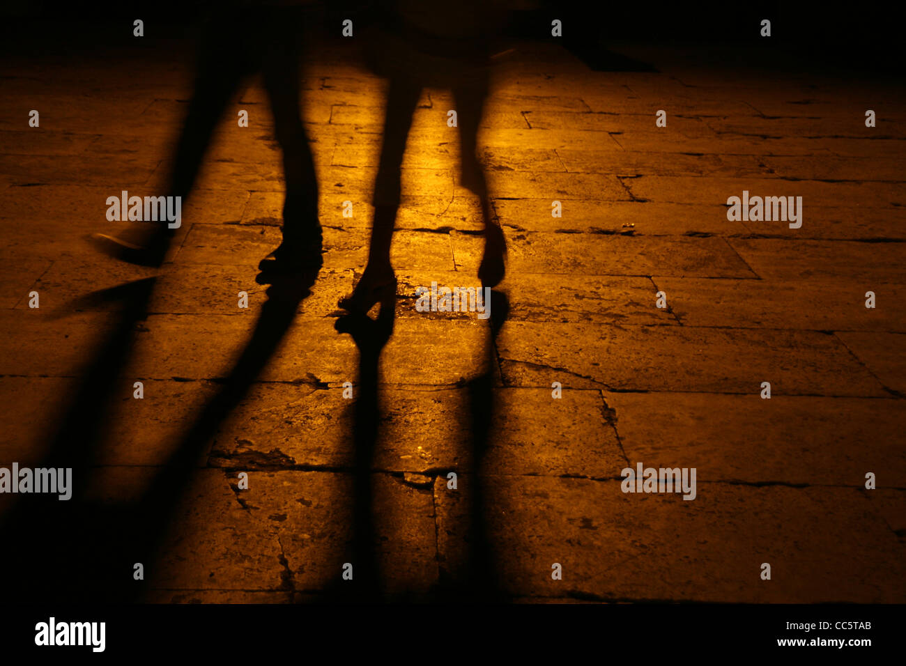 people walking in street at night Stock Photo - Alamy
