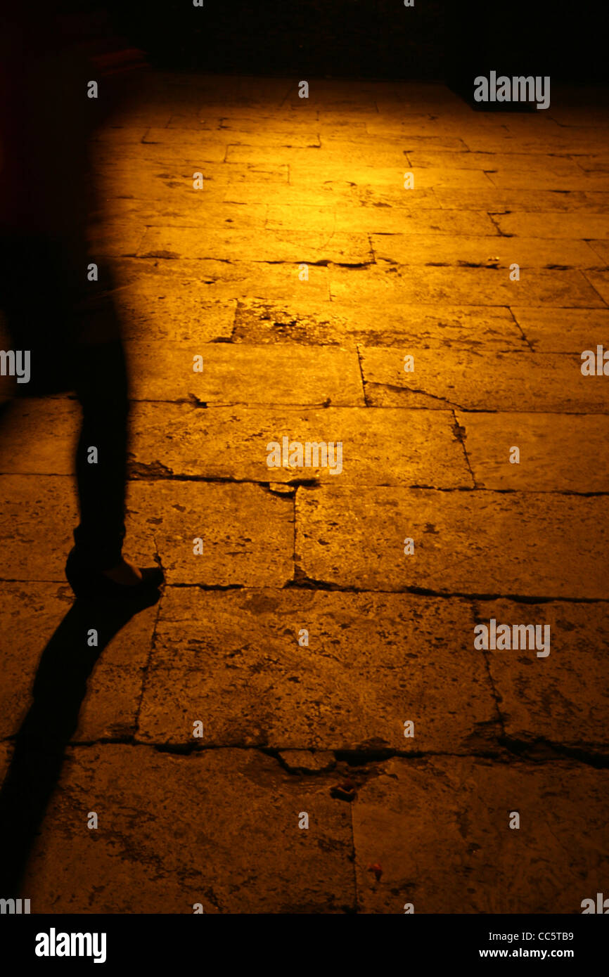 Man walking down back alley hi-res stock photography and images - Alamy