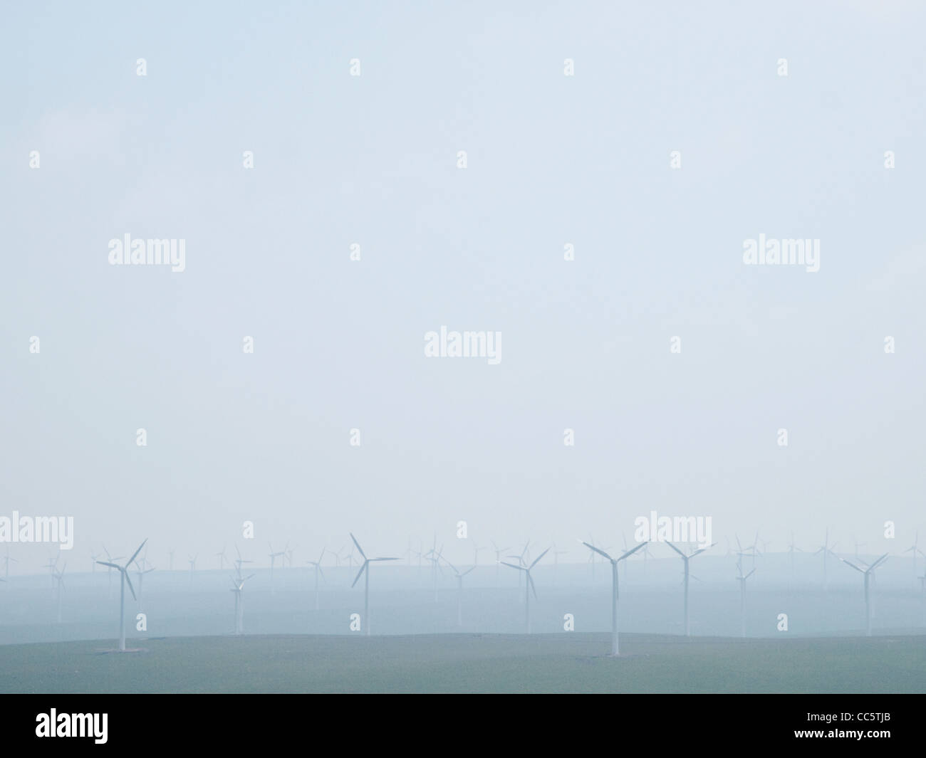 Wind generator in mist, Hexigten Global Geopark, Chifeng, Inner ...