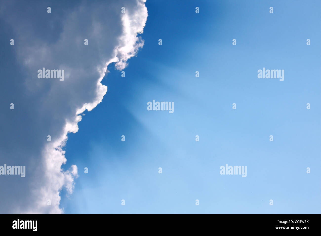 Sunbeam on blue sky Stock Photo - Alamy