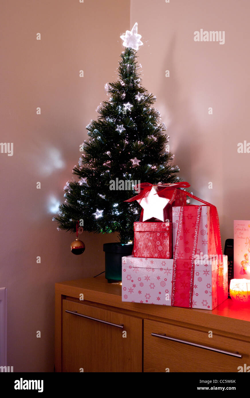 Christmas presents tree wrapped lights hi-res stock photography and ...