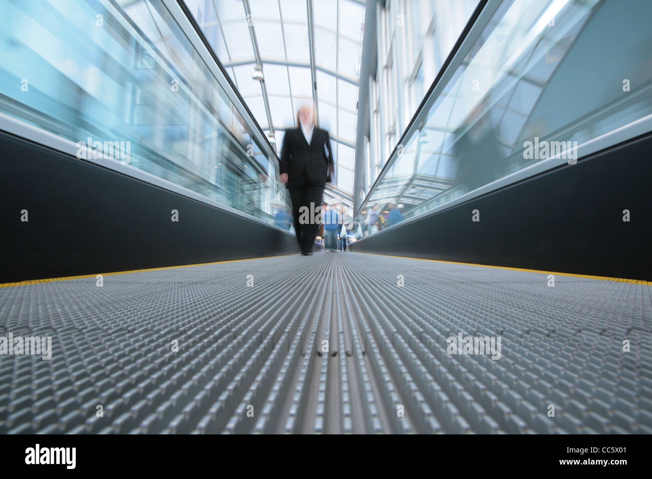 People on moving escalator Stock Photo - Alamy