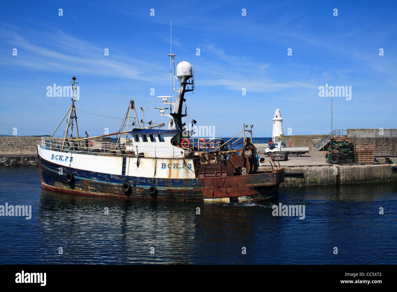fishing boat leaving macduff Stock Photo - Alamy