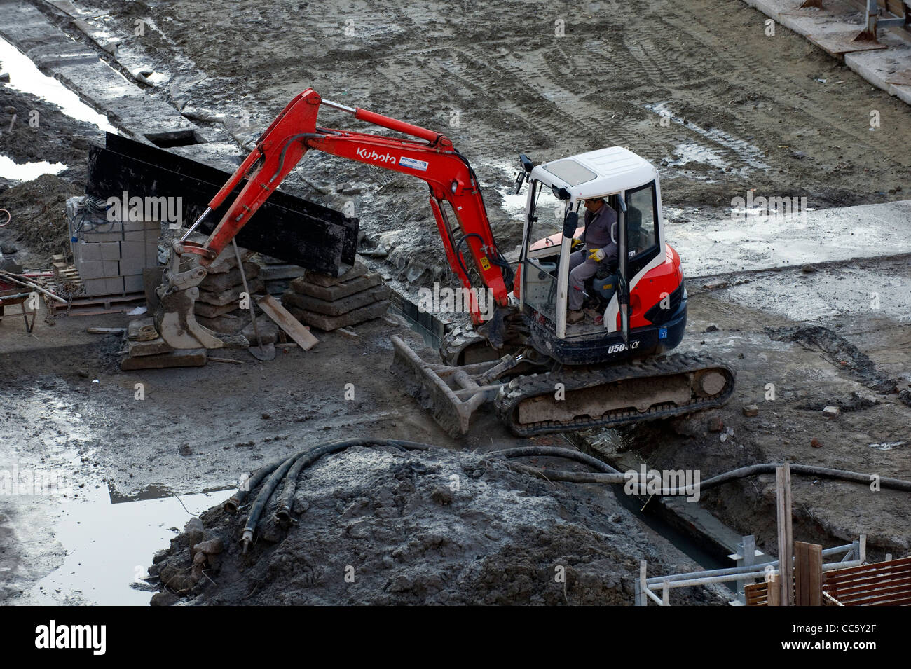 Red Mechanical Digger working on the Piazza San Marco Stock Photo - Alamy
