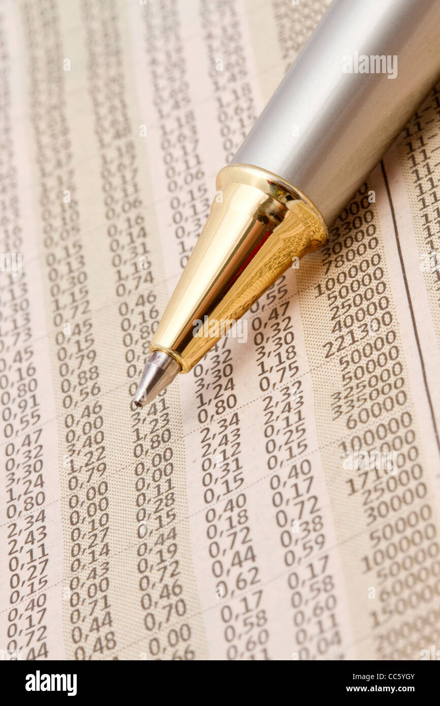Analyzing the stock market with a pen Stock Photo - Alamy