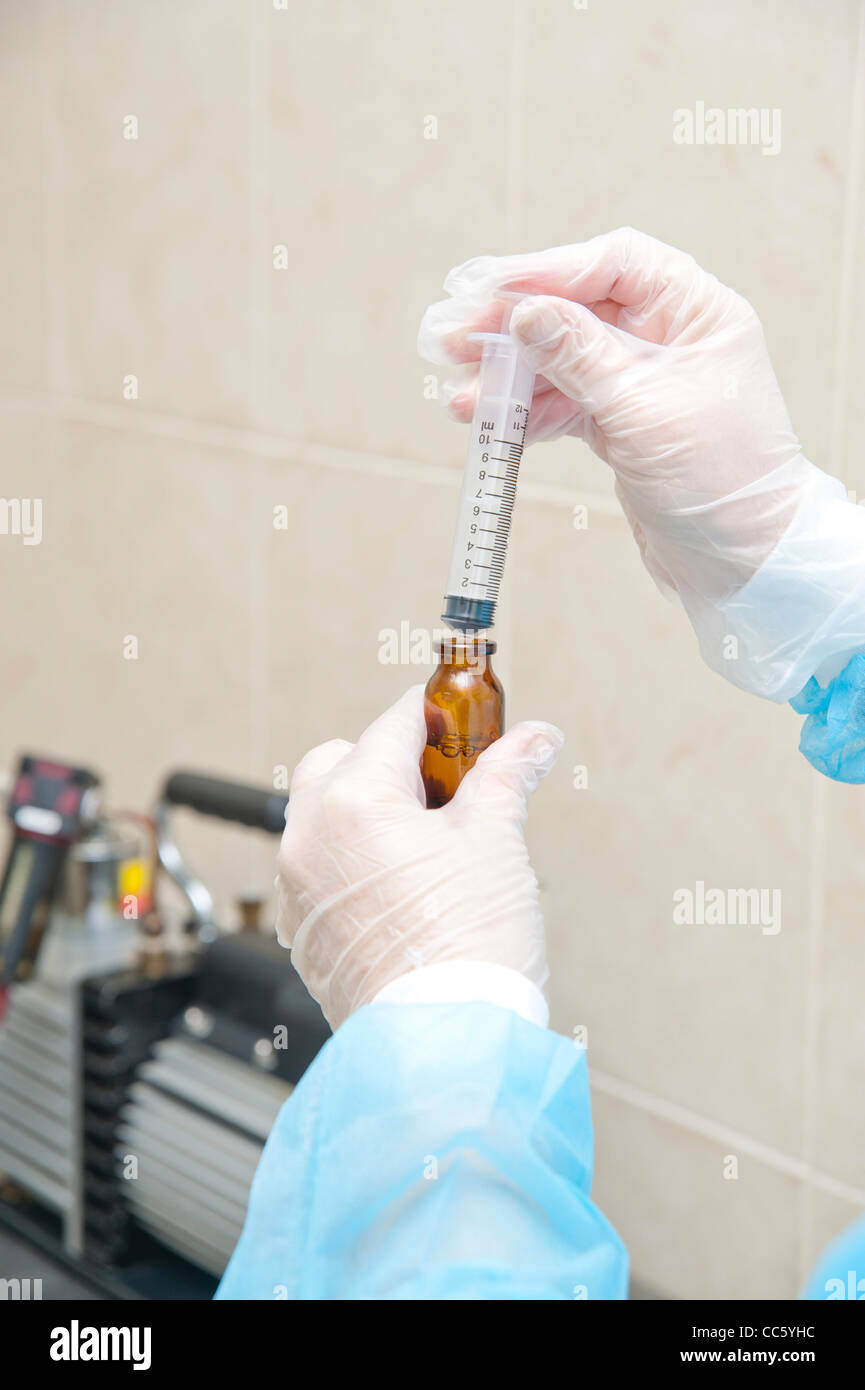 Lab technician gloves protective clothing hi-res stock photography and ...