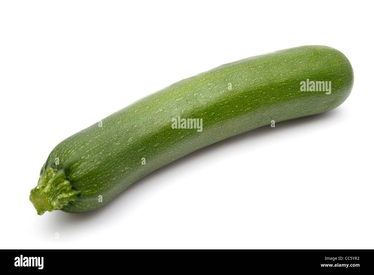 green zucchini closeup on white background Stock Photo - Alamy