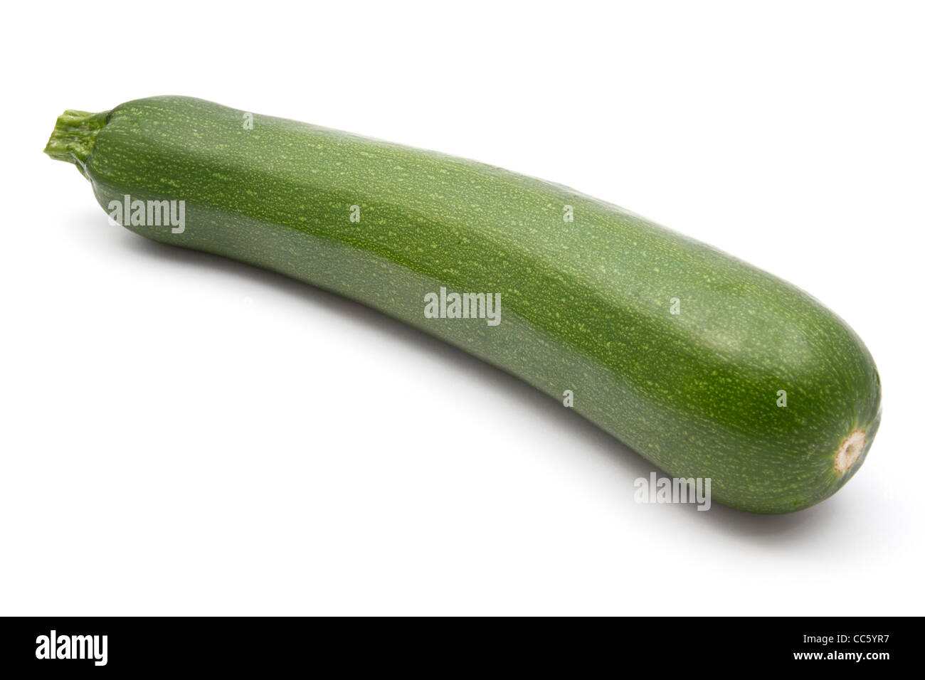 green zucchini closeup on white background Stock Photo - Alamy