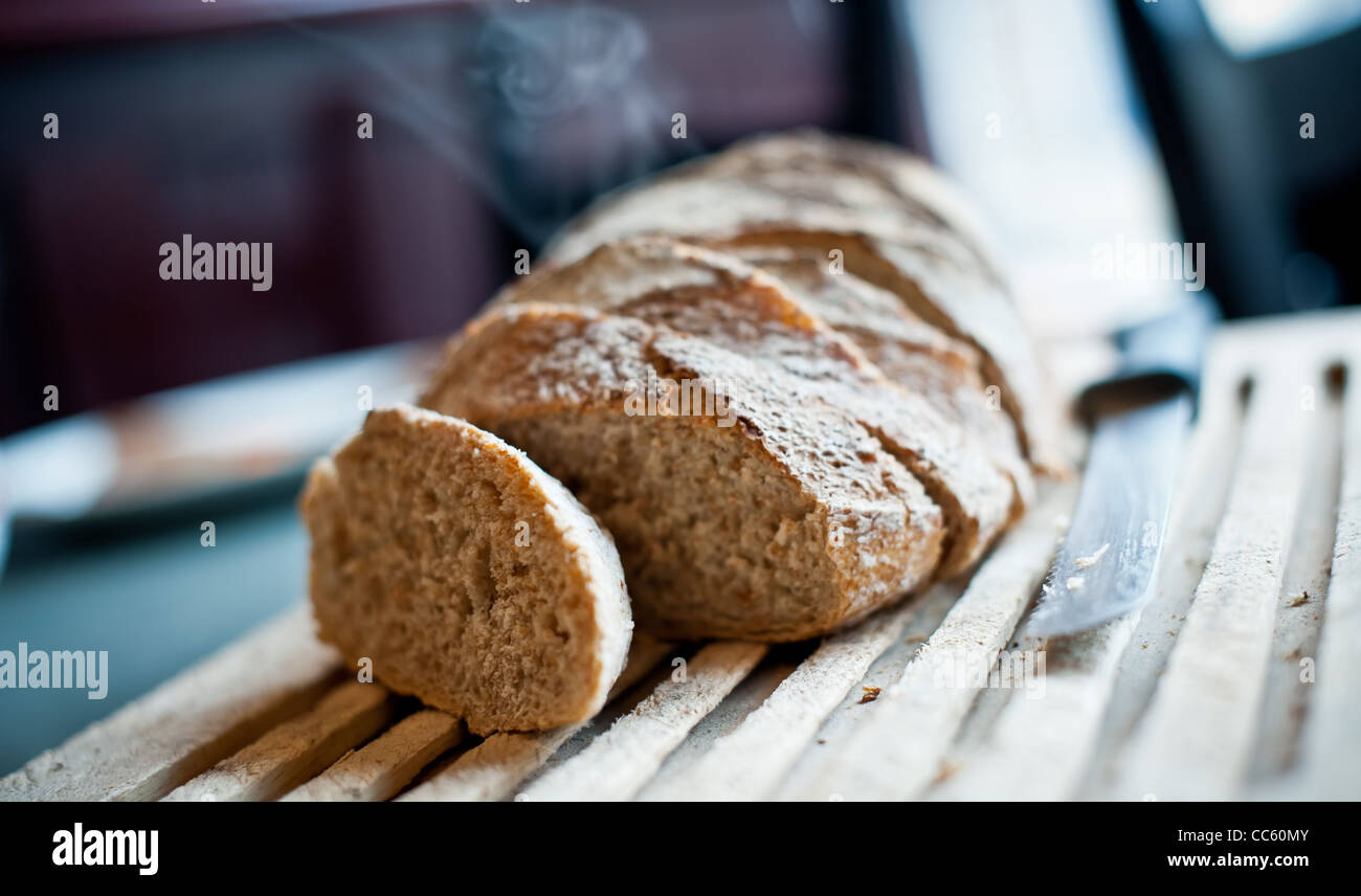 Bread being baked in a traditional style oven Stock Photo - Alamy
