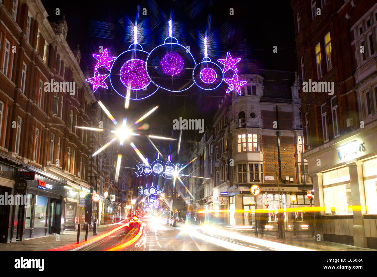 Christmas street lights and traffic by night on Marylebone Street ...
