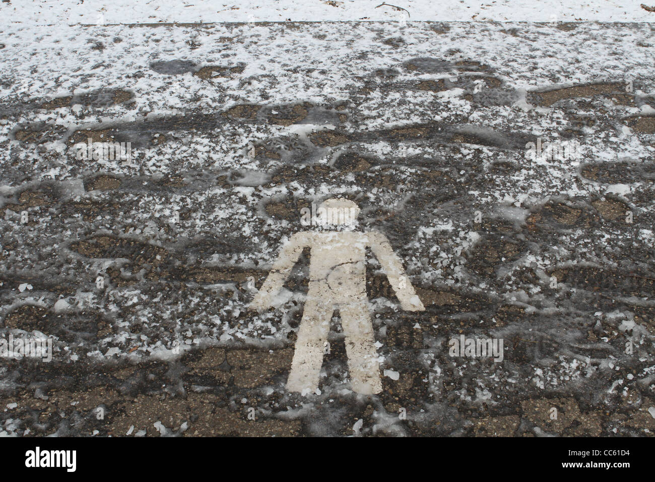 A pedestrian symbol on an icy path Stock Photo - Alamy