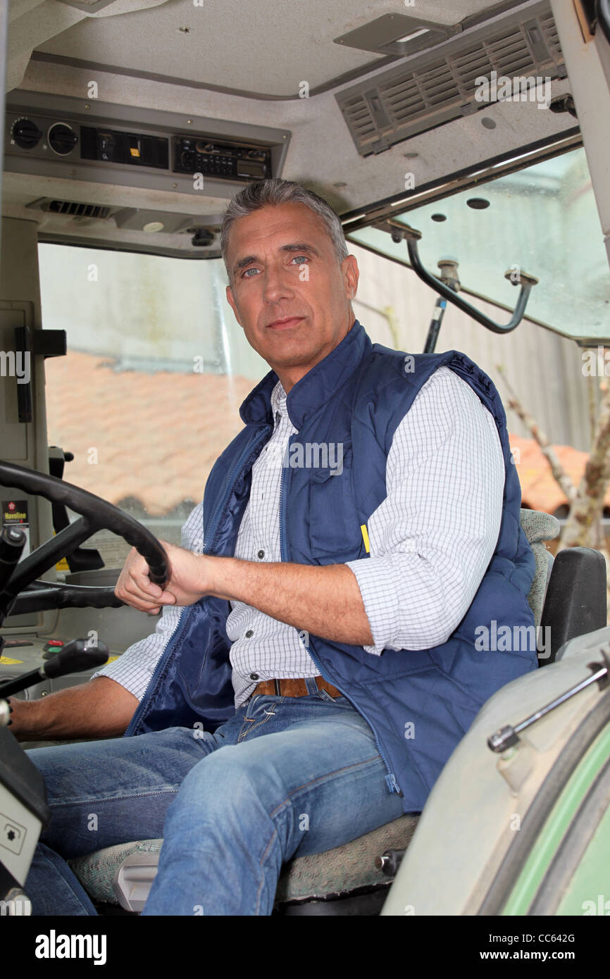 portrait of a farmer in tractor Stock Photo - Alamy