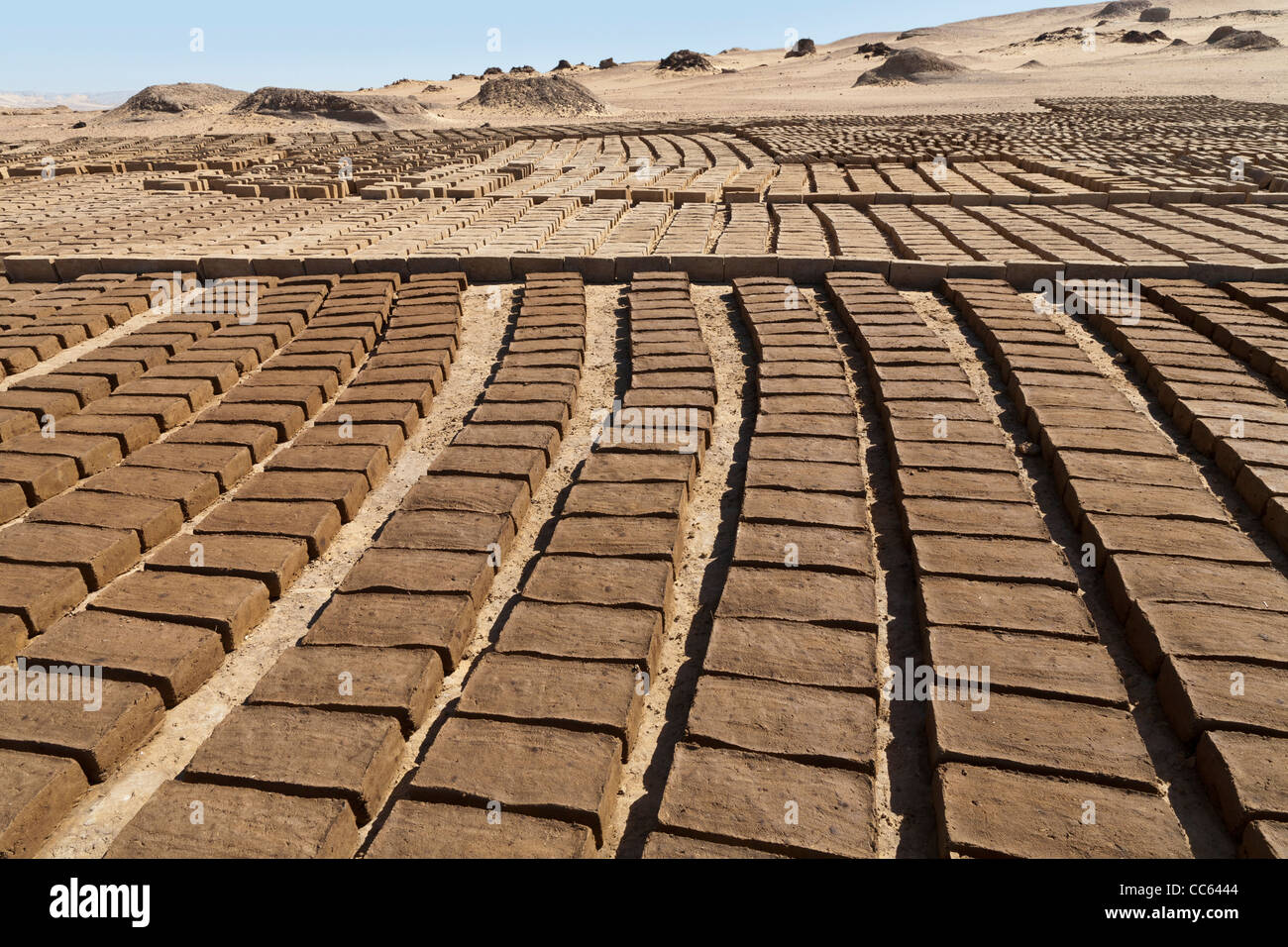 Newly formed mud bricks being made at the ancient site of Dush, South ...