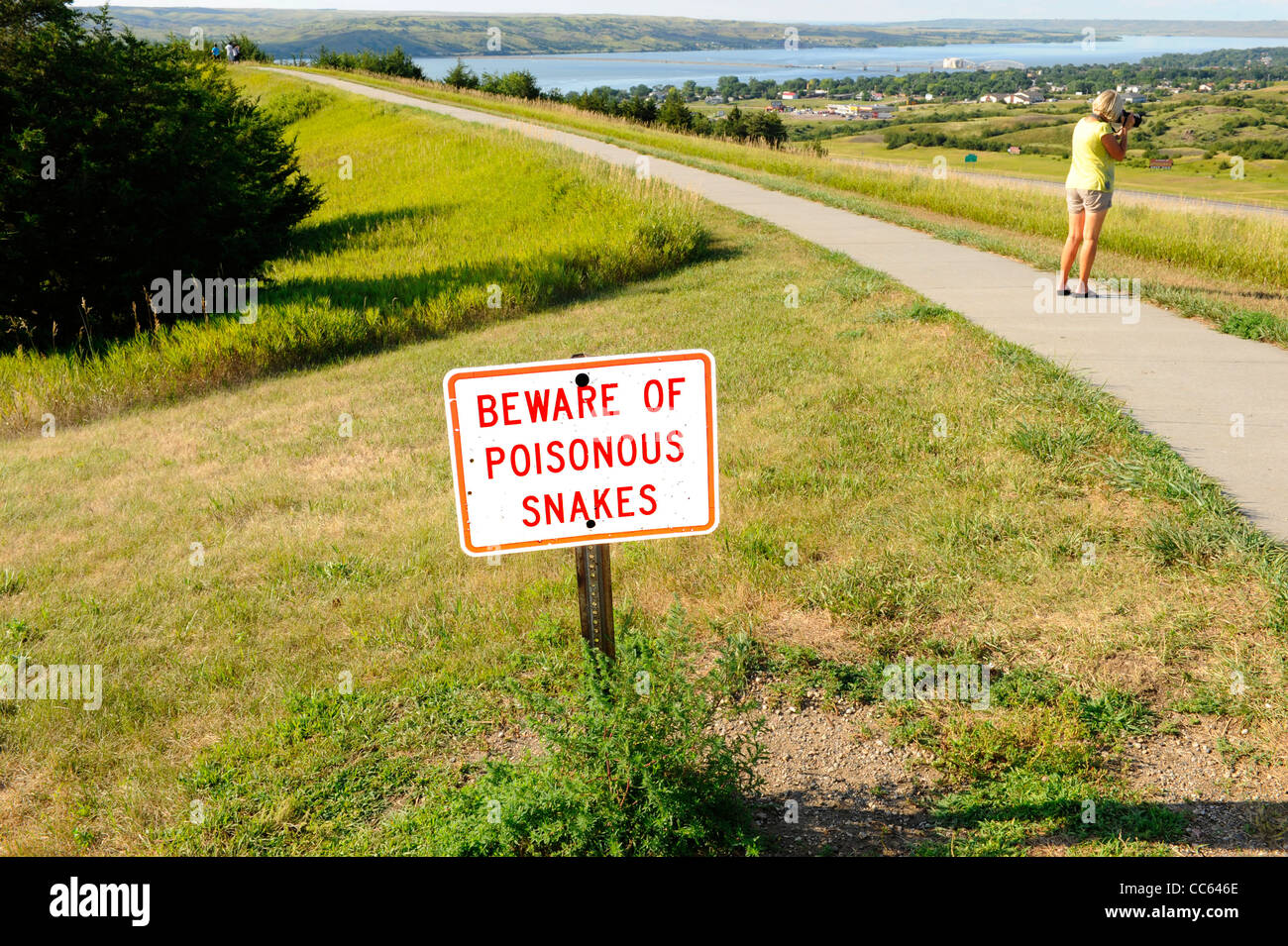 Poisonous snakes sign on a walking path Stock Photo - Alamy