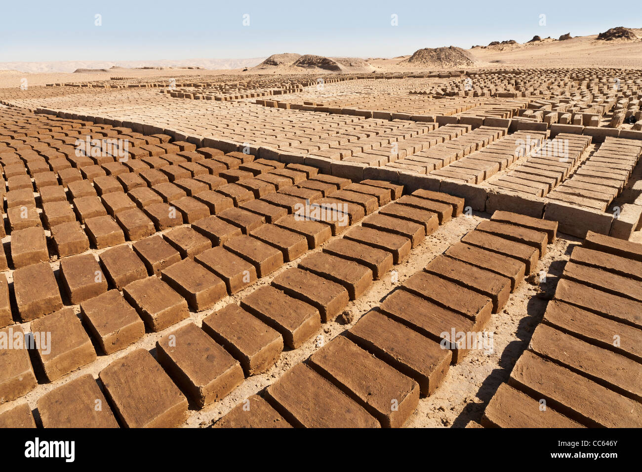 Newly formed mud bricks being made at the ancient site of Dush, South ...