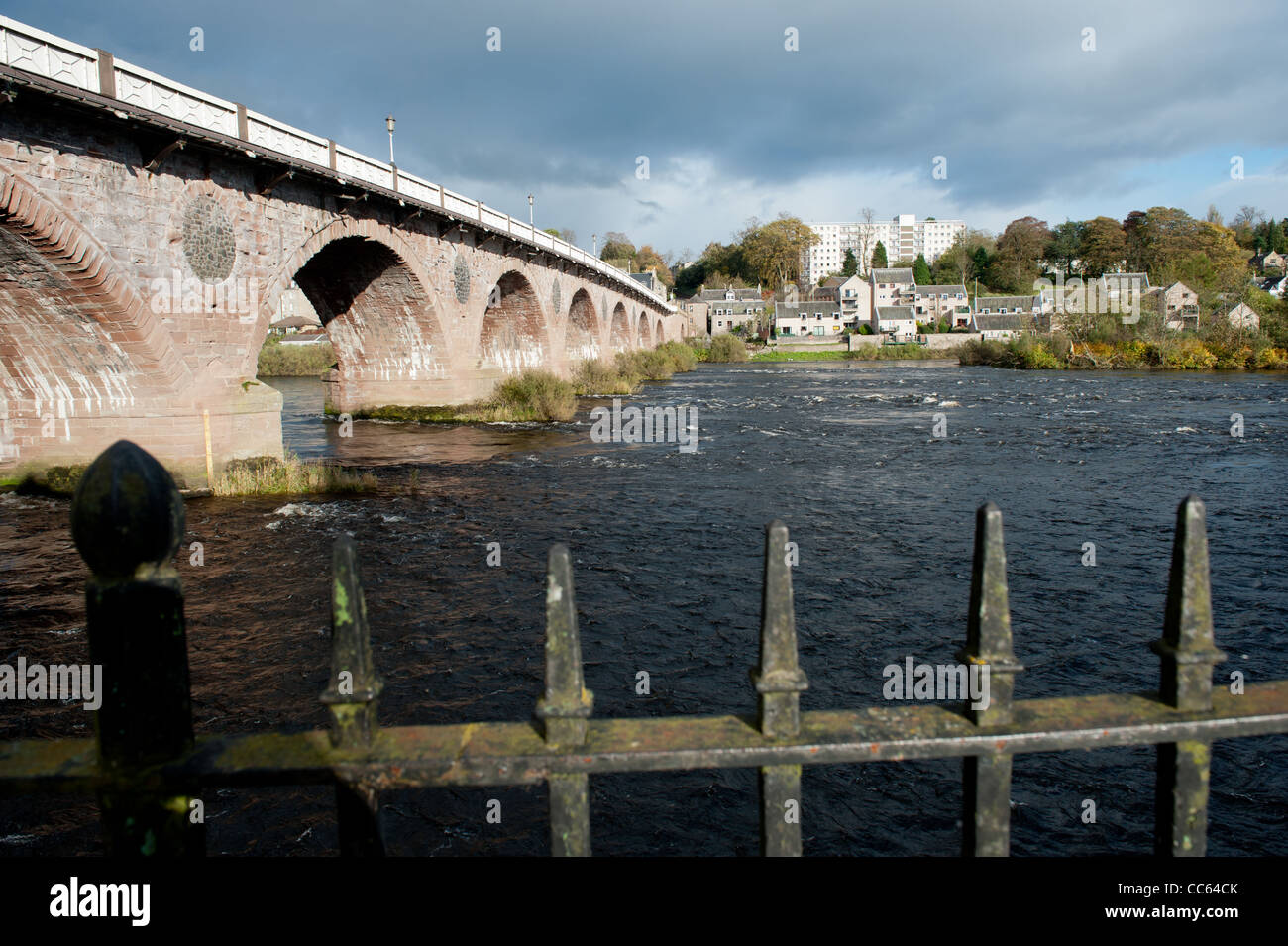 The Smeaton bridge running over the Tay in Perth lit by the evening ...