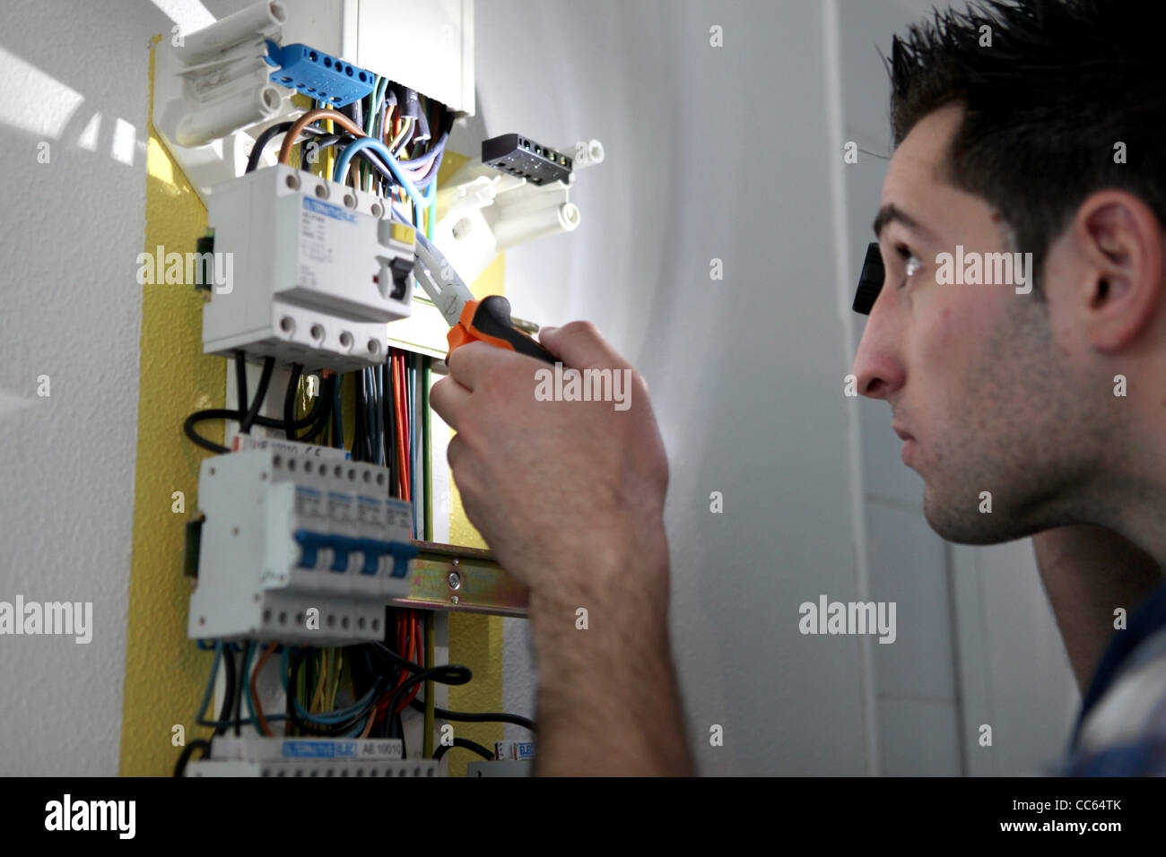 Man repairing fuse box Stock Photo - Alamy