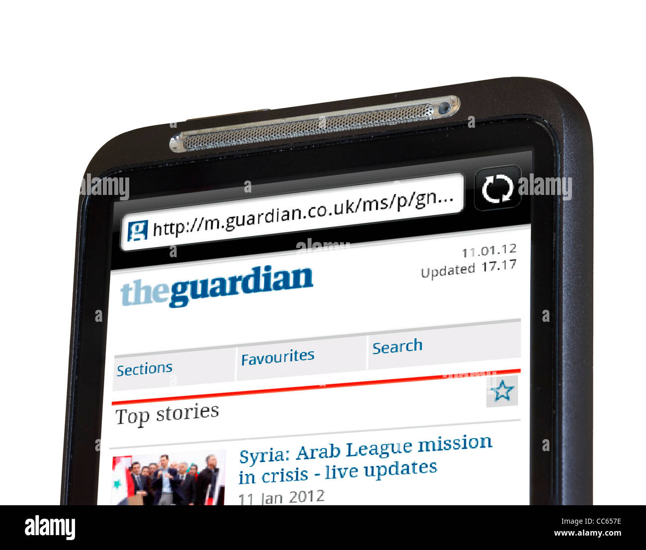 Browsing The Guardian online newspaper on an HTC smartphone Stock Photo ...