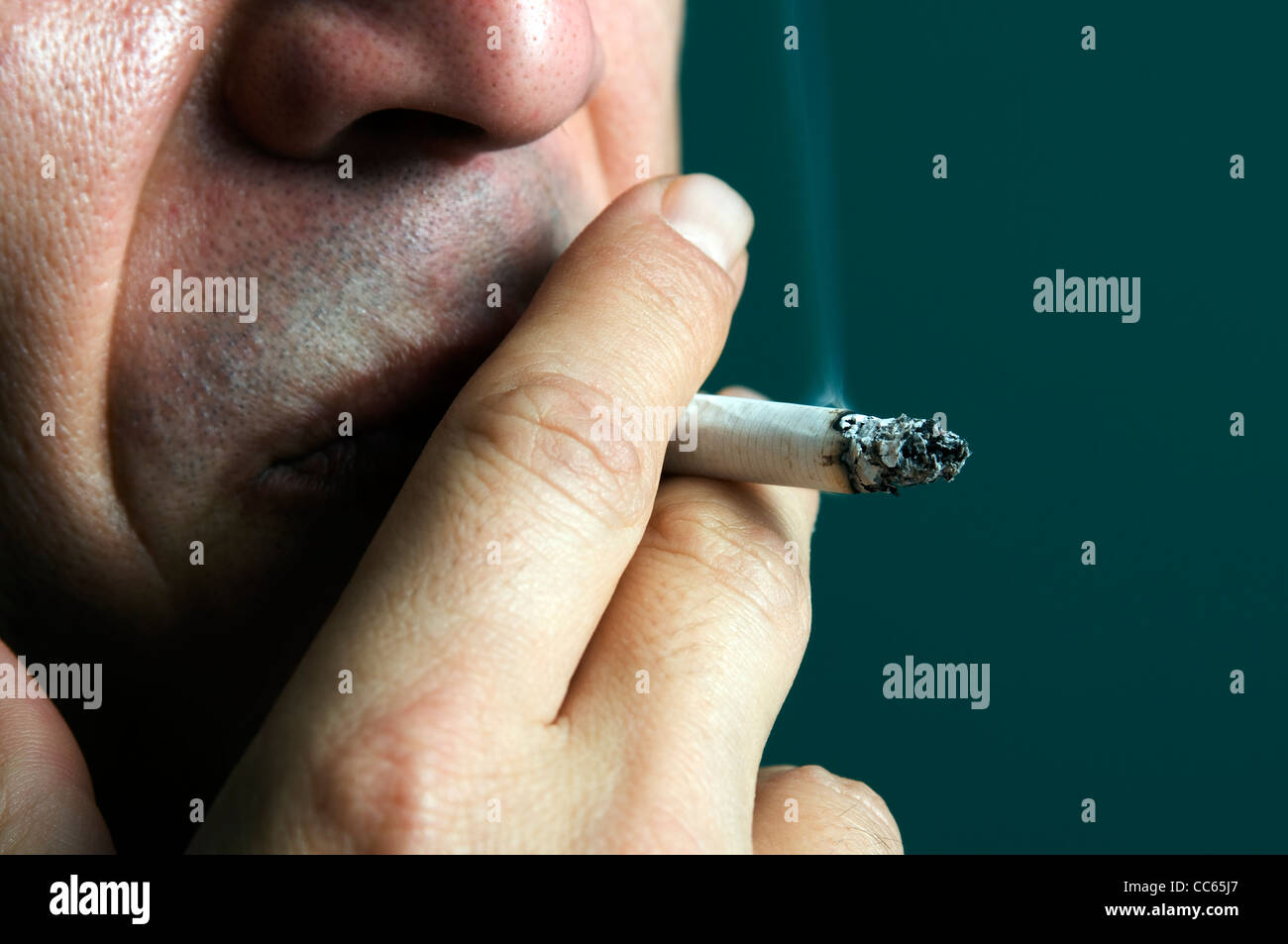 Bad habit, smoking cigarette Stock Photo - Alamy