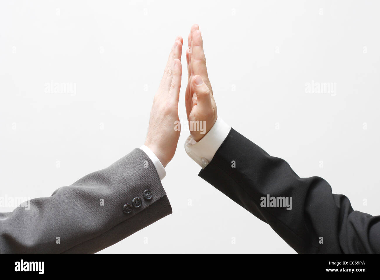 Business men doing a high five Stock Photo - Alamy